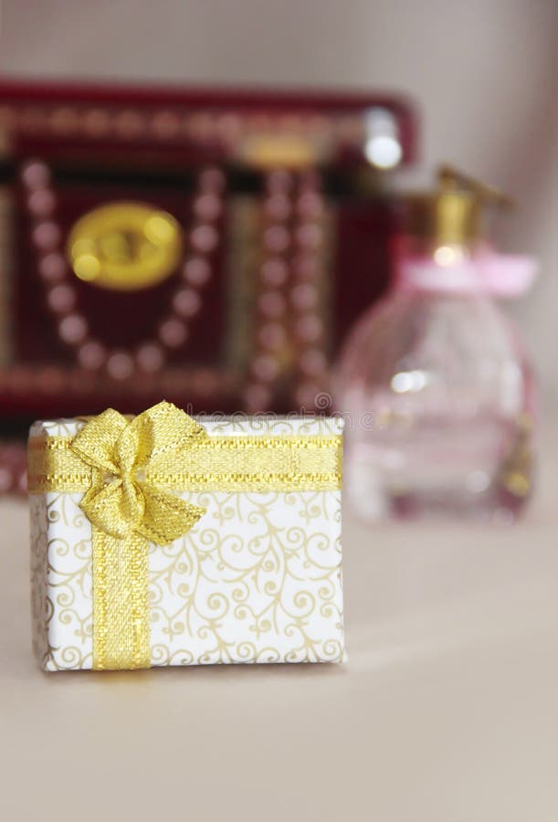 Gift Box with Patterns and a Yellow Bow on a Decorative Background ...