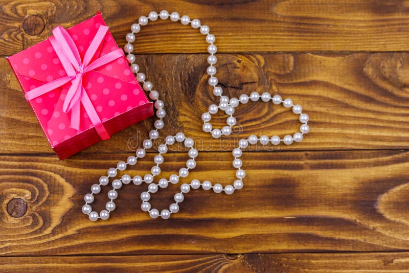 Gift Box and Pearl Necklace on Wooden Background Stock Photo - Image of ...