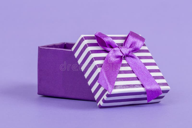 Gift box on purple stock image. Image of package, celebration - 48501799