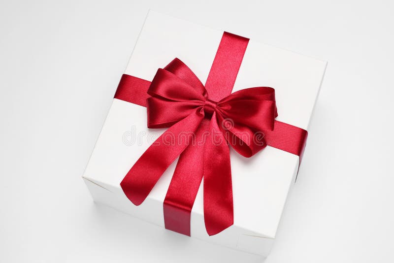 Gift Box with Red Bow on Light Grey Background, Above View Stock Photo ...
