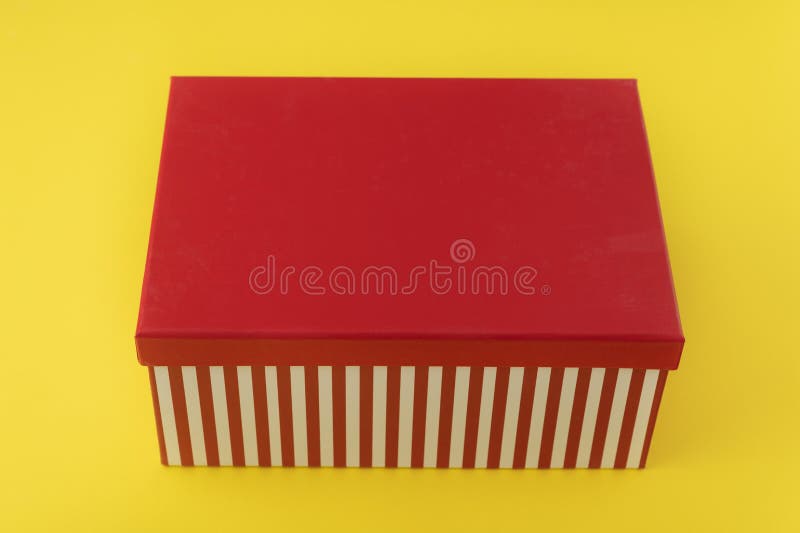 Gift Box with Red Lid on Yellow Background. Copy Space Stock Photo ...