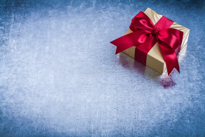 Gift Box with Red Present Tape on Metallic Surface Copyspace Stock ...