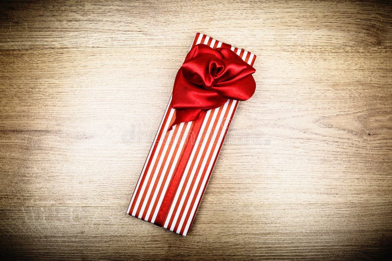 Gift Box with Red Stripes and a Bow in the Form of Roses Stock Photo ...