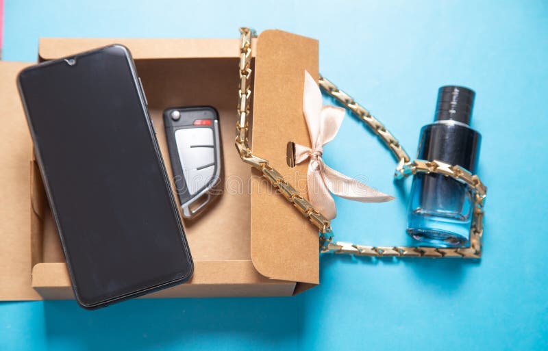 Gift Box with a Smartphone, Perfume, Car Key, Gold Necklace Stock Image ...