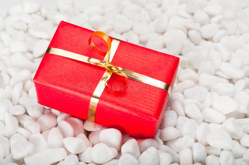 Gift Box on Stones stock photo. Image of giving, present - 16542108