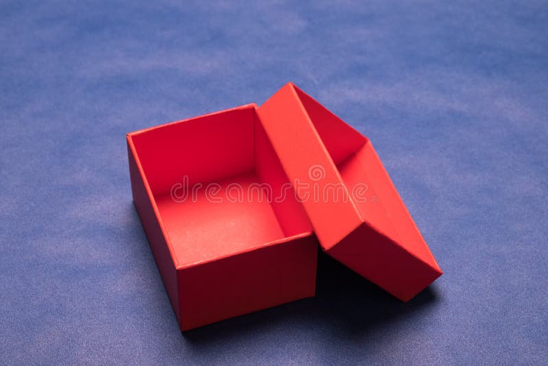 Red Gift Box on a Blue Background. Empty Gift Box Stock Photo - Image ...