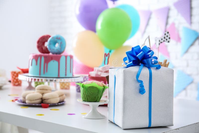 Gift Box on Table with Sweets Prepared for Birthday Party Stock Image ...