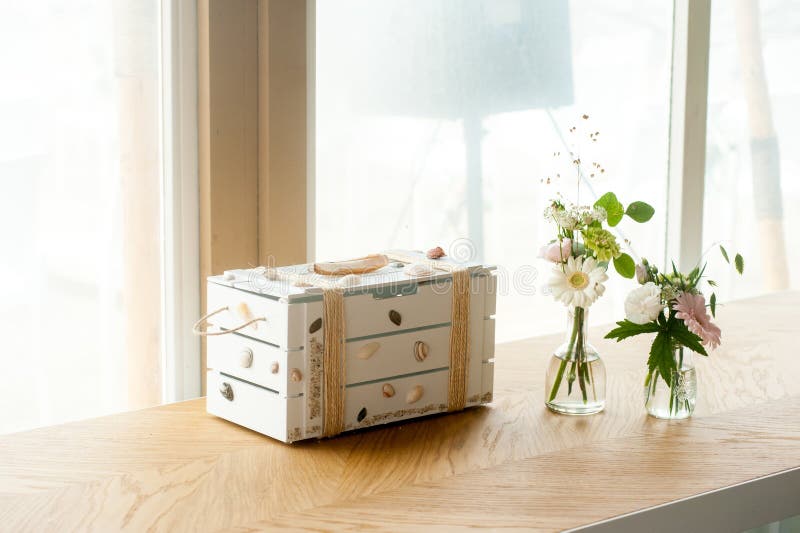 A gift box on a table stock image. Image of shipping - 259342421