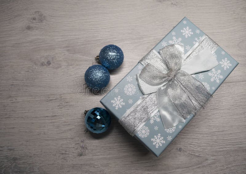 Gift box and three balls stock image. Image of christmas - 202166905