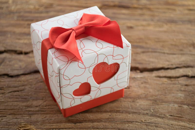 Gift Box with Two Red Hearts on Side on Wooden Background Stock Image ...