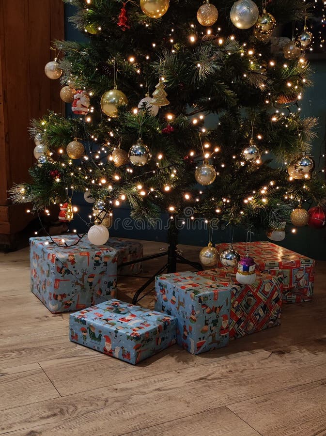 Gift Box Under a Christmas Tree during Christmas Stock Image - Image of ...