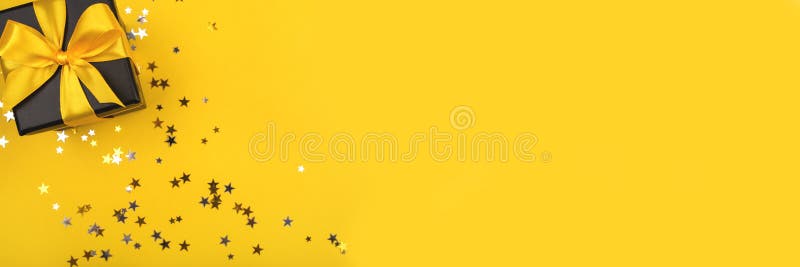 Gift Box on Yellow Background with Sparkling Confetti Stock Image ...