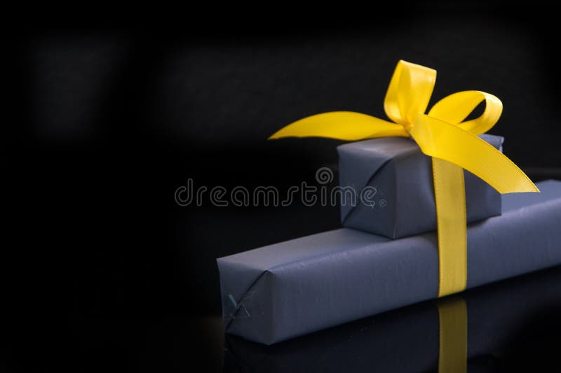 A Gift Box with a Yellow Ribbon on Top of Another Gift Box Stock Photo ...