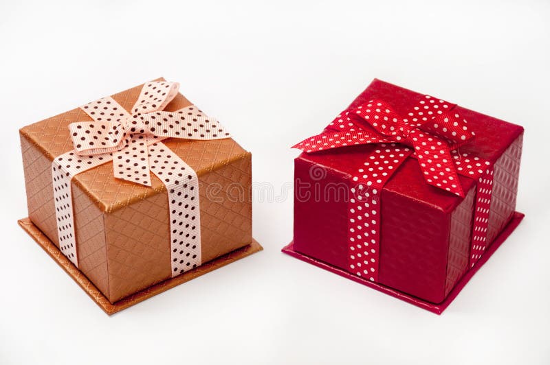 GIFT BOXES with BOW OVER WHITE Stock Photo - Image of orange, gold ...