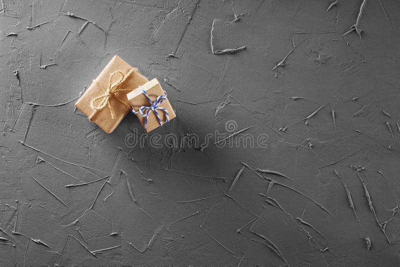 Gift Boxes in Craft Paper on Concrete Background Stock Image - Image of ...