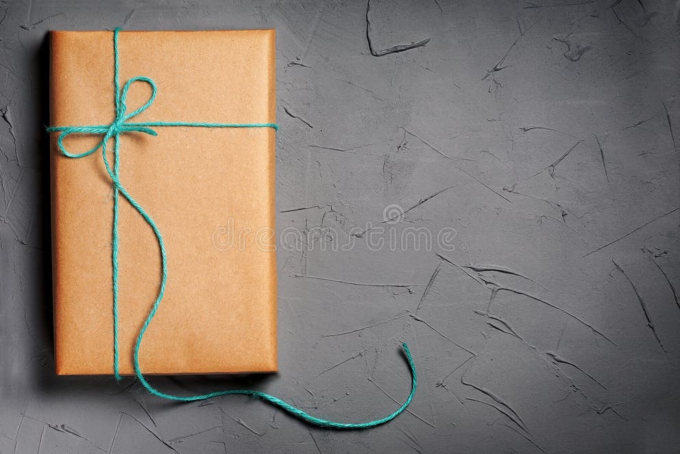 Gift Boxes in Craft Paper on a Concrete Background Stock Image - Image ...