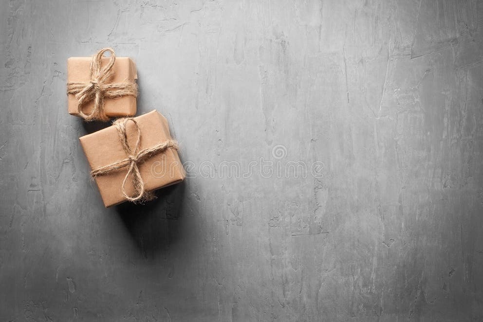 Gift Boxes in Craft Paper on Concrete Background Stock Photo - Image of ...