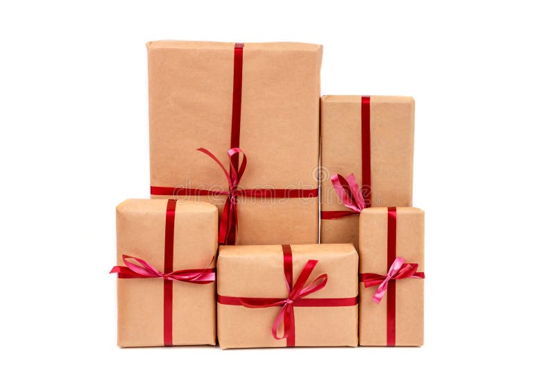 Gift Boxes in Craft Wrapping Paper with Red Ribbons Isolated Stock ...