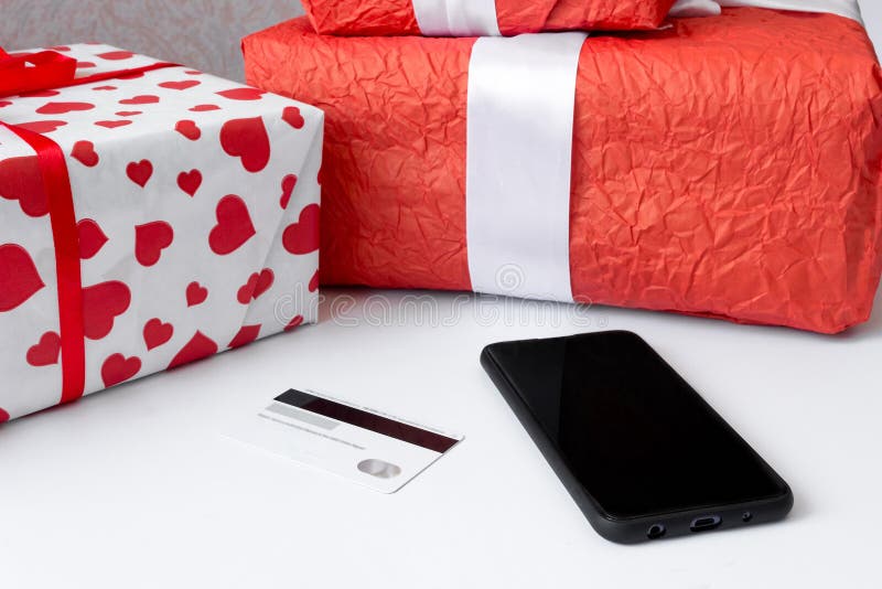 Gift Boxes with Credit Card and Smartphone on the Table. Online ...