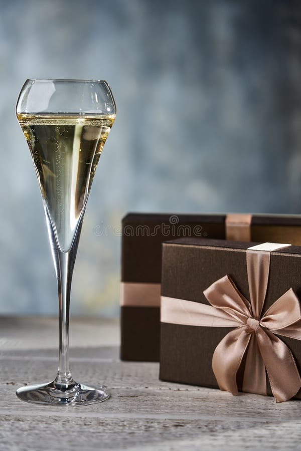 Gift Boxes and a Glass of Champagne Stock Image - Image of raising ...