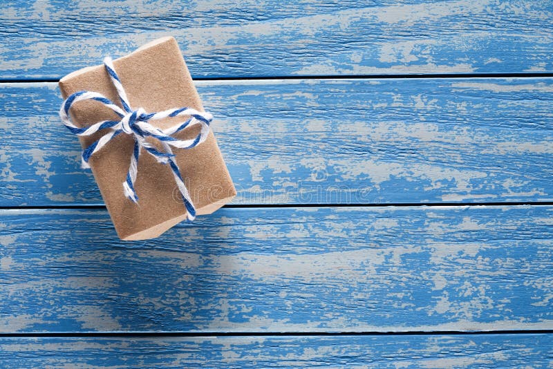 Gift Boxes in Paper on a Blue Wooden Table Stock Photo - Image of love ...