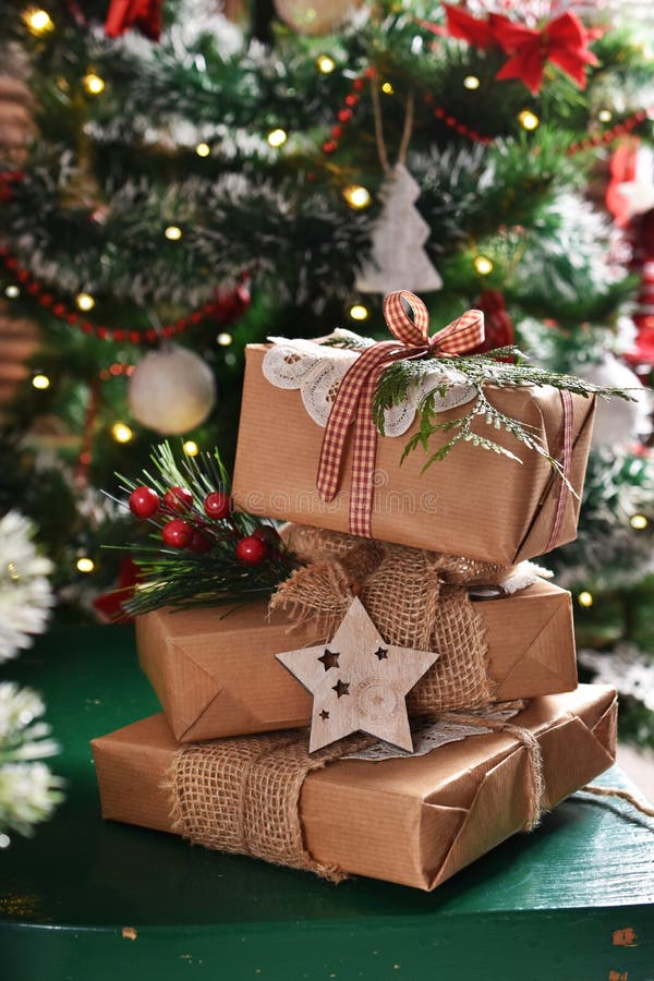 Gift Boxes in Rustic Style in Front of Christmas Tree Stock Image ...
