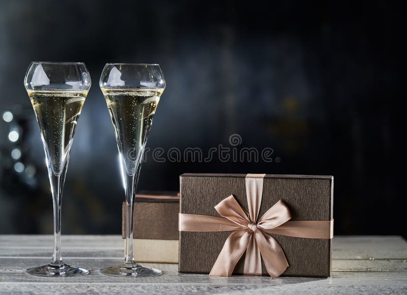 Gift Boxes and Two Glasses of Champagne. Dark, Black Background. Stock ...