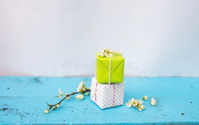 Gift Boxes of White and Light Green Color on a Blue Spring Background ...