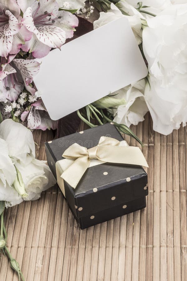 Gift and Flowers with Name Tag Stock Image - Image of pink, present ...