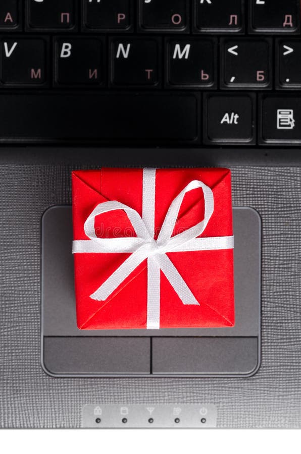 Gift on a laptop keyboard stock image. Image of office - 22456487