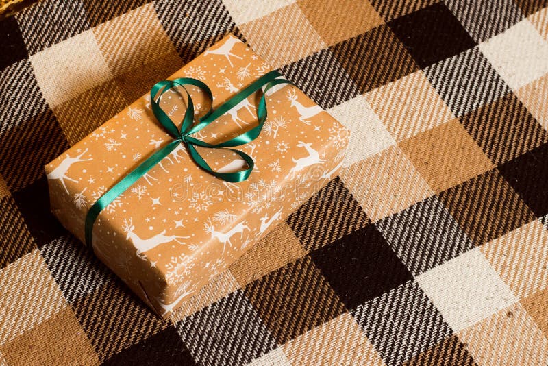 Gift Packed in Beautiful Box on Brown Plaid, Copy Space Background ...