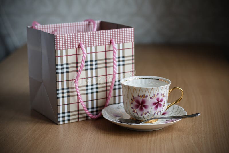 Gift Packet and Cup with a Saucer Stock Image - Image of package, tree ...