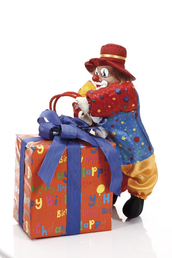 Gift Parcel and Clown Figurine Stock Photo - Image of clown ...
