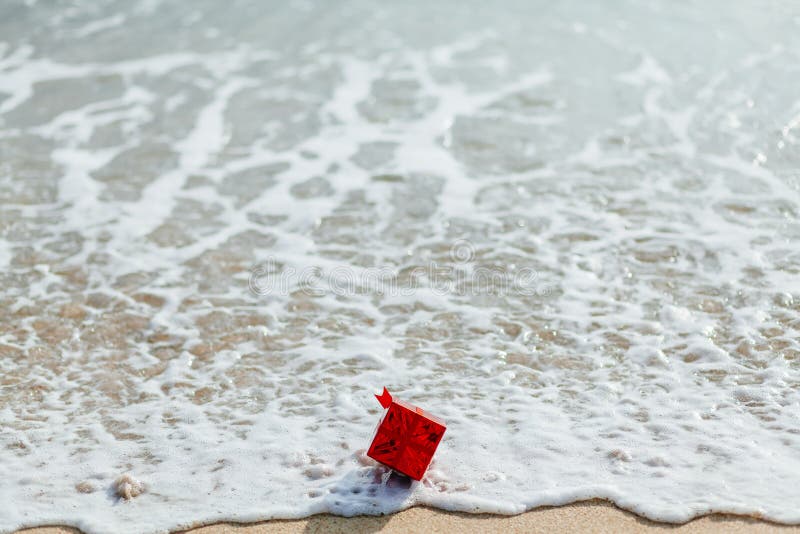 Gift red box in the sea stock image. Image of beautiful - 47570253