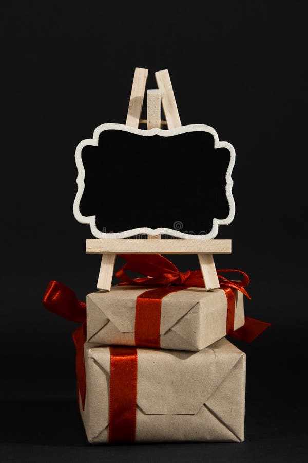 Gift with Red Ribbon and Frame Plaque on a Black Background, Layout for ...