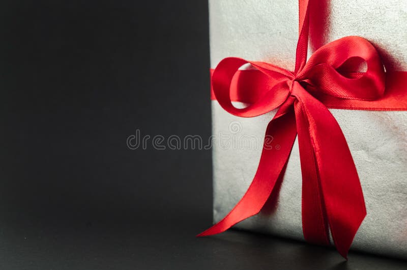 Gift in Silver Packaging with Red Ribbon and Greetings with Valentine`s ...