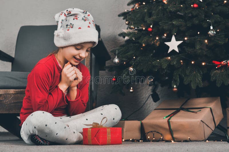 Gift. a Gift Under the Christmas Tree in a Red Package. Christmas New ...