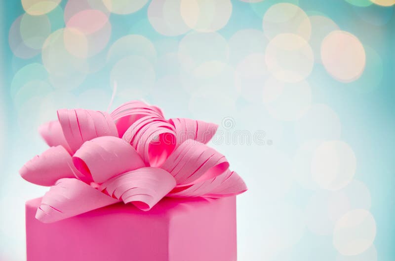 Gift Box Wrapped in Pastel Paper with Pink Ribbon on Pink Surface. Top ...