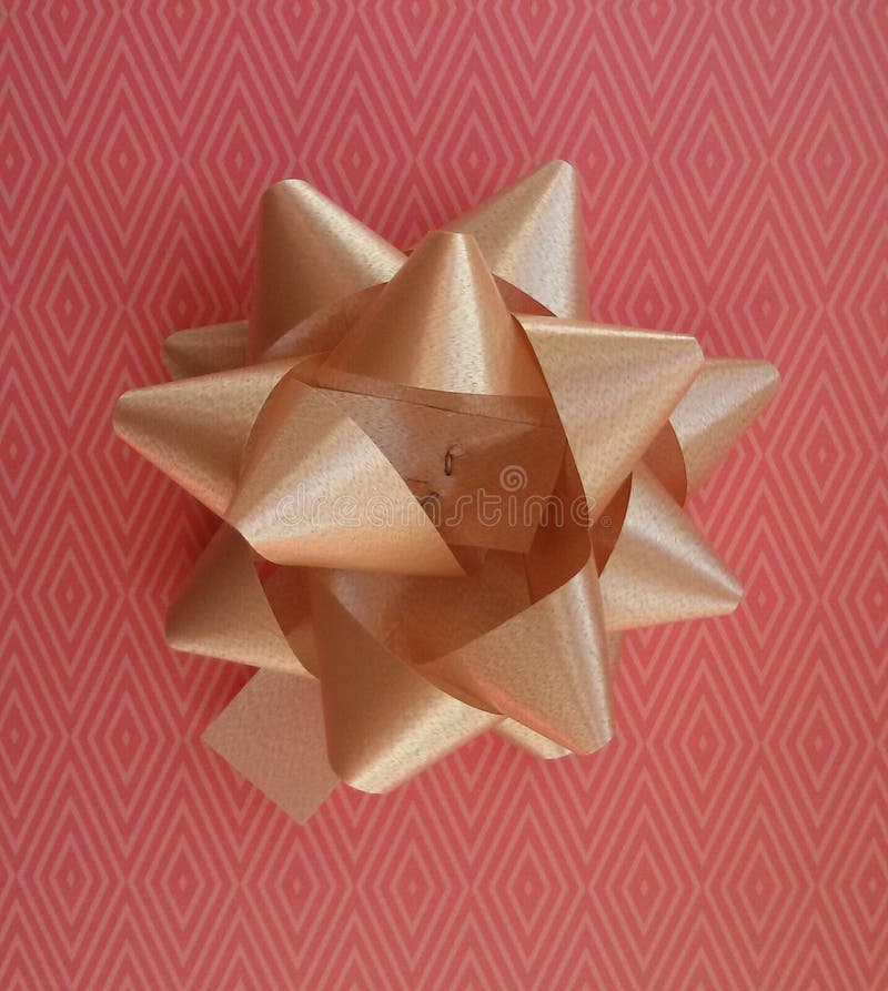 Gift Wrapping Idea. Pink Paper and Golden Bow. Stock Image - Image of ...