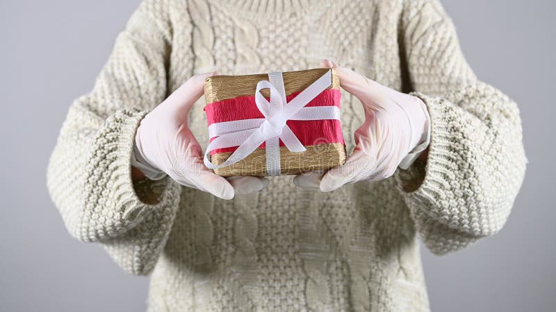 Gift Wrapping with Rubber Gloves. Girl Holding Gift Wrap in Rubber ...
