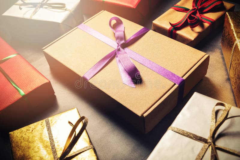 Gift Wrapping Service - Wrapped Present Boxes on Dark Table Stock Photo ...
