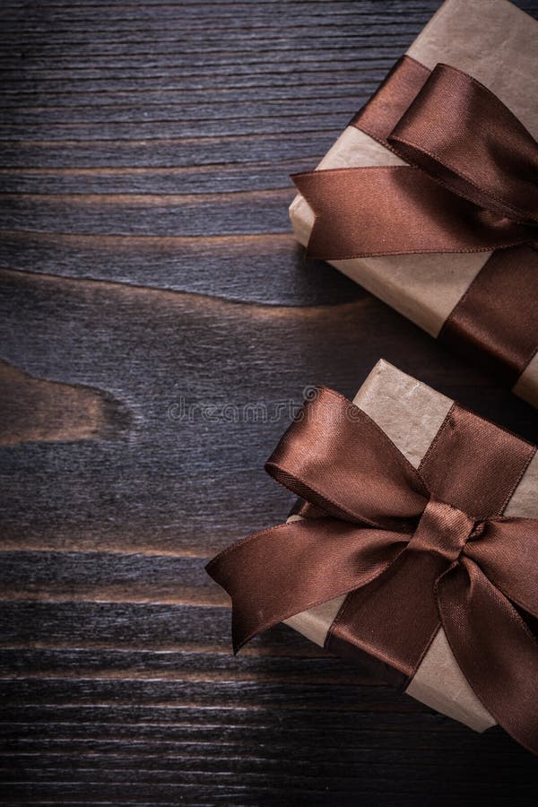 Giftboxes with Brown Ribbons on Vintage Wood Board Stock Image - Image ...