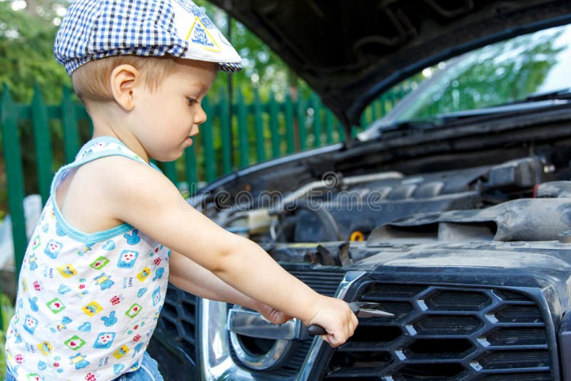Gifted Kid Repairing Car Engine Stock Image - Image of holding, repair ...