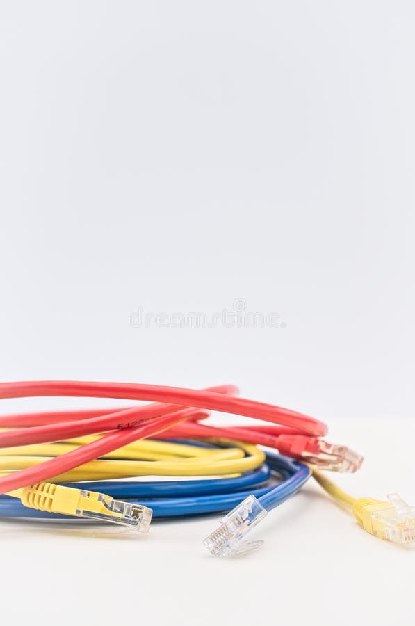 Gigabit RJ45 Networking Cables on a Desk with White Wall Background ...