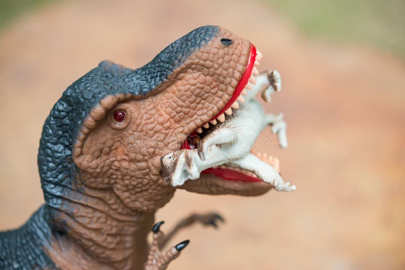Gigantic Tyrannosaurus Bites Smaller Dinosaur Stock Photo - Image of ...