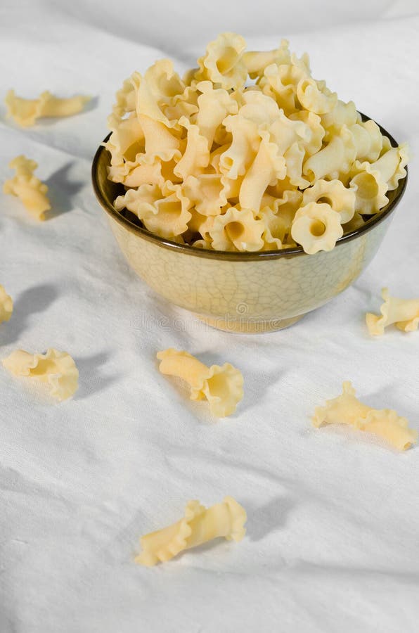 Gigli Pasta in Little Ceramic Bowl on White Fabic. Stock Image - Image ...