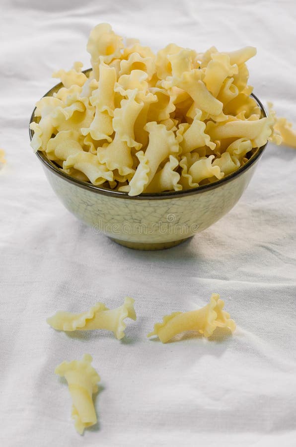 Gigli Pasta in Little Ceramic Bowl on White Fabic. Stock Photo - Image ...