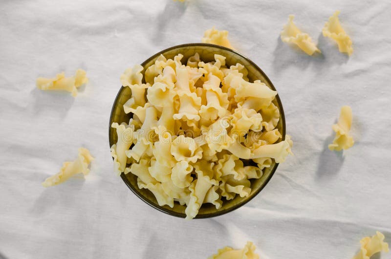 Gigli Pasta in Little Ceramic Bowl on White Fabic. Stock Image - Image ...