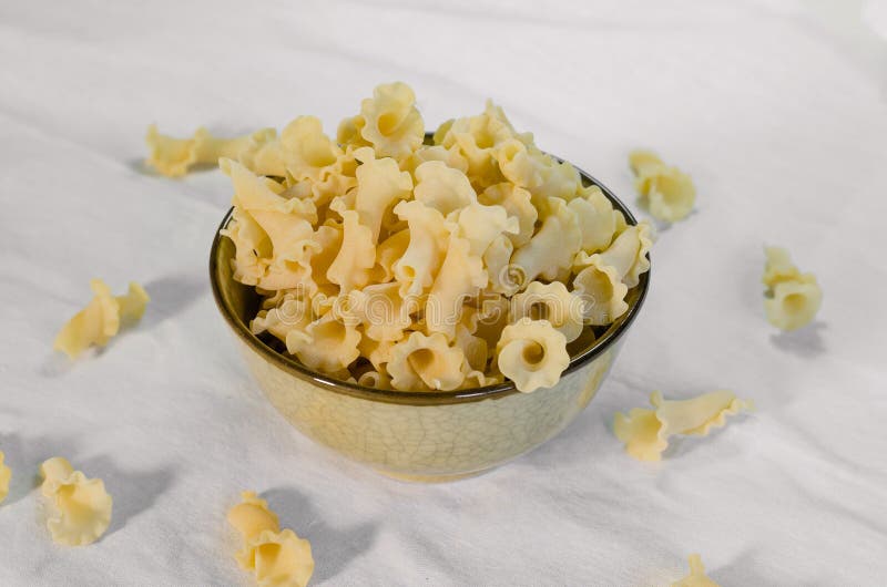 Gigli Pasta in Little Ceramic Bowl on White Fabic. Stock Image - Image ...
