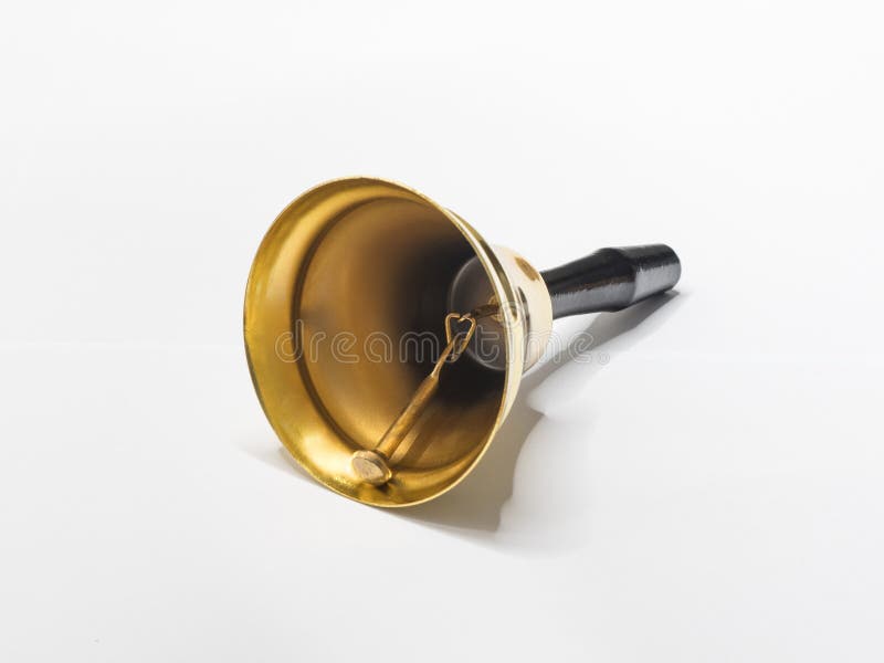 Gilded Bell with a Handle Made of Black Plastic Isolated on a White ...